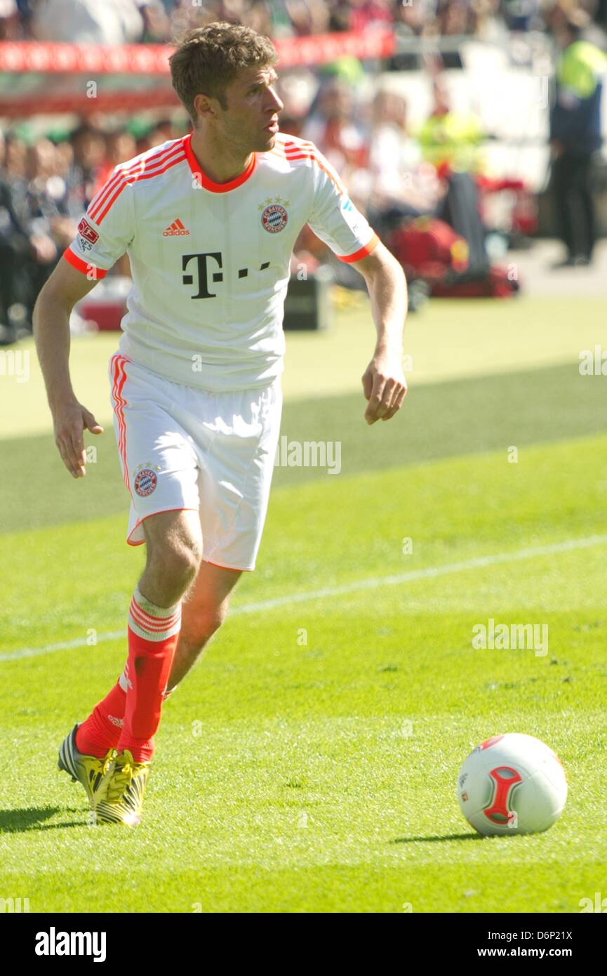 Munich's Thomas Mueller kicks the ball during the Bundesliga soccer ...