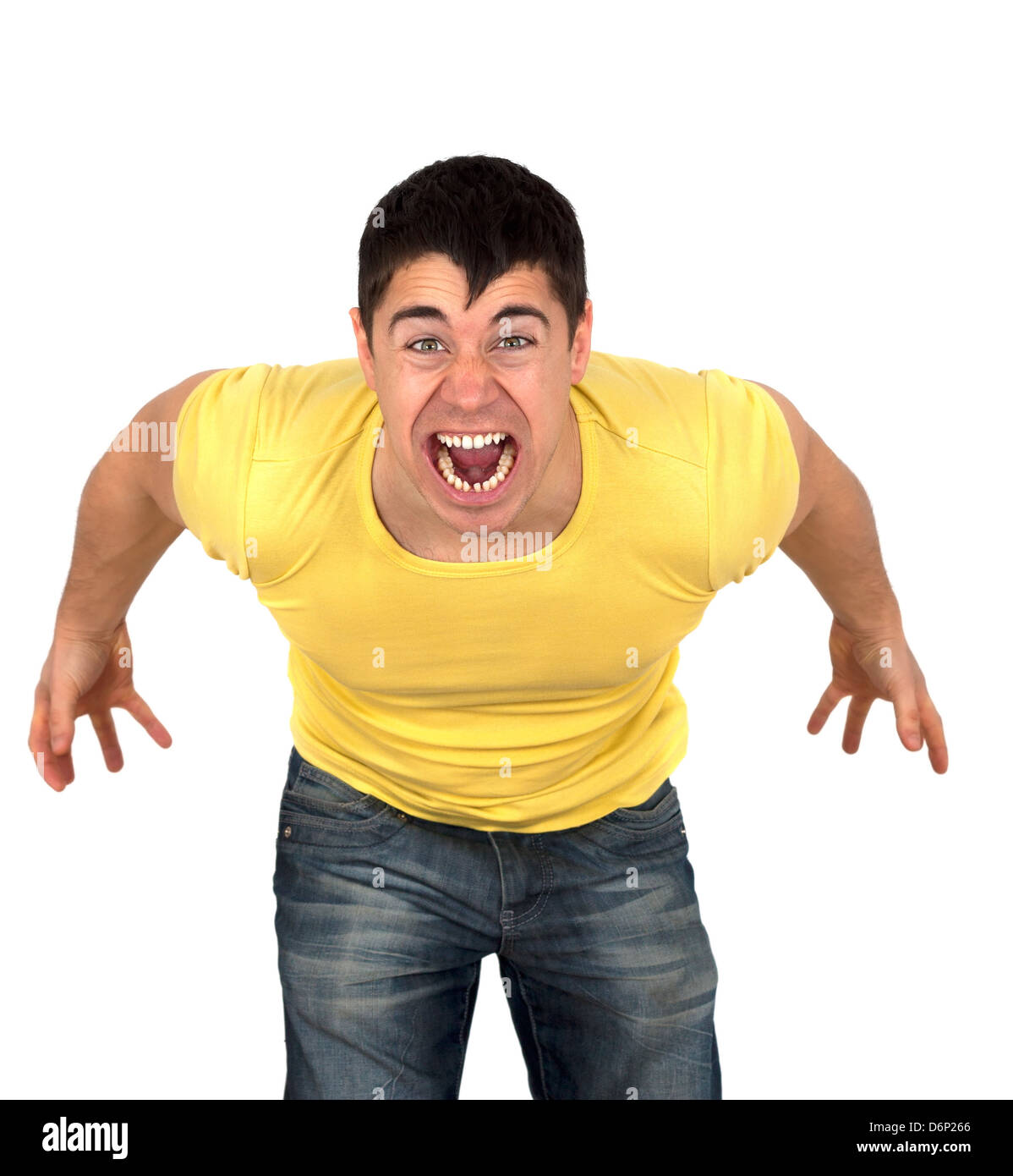 Young athletic muscular man shouting or yelling with fury.Isolated on ...