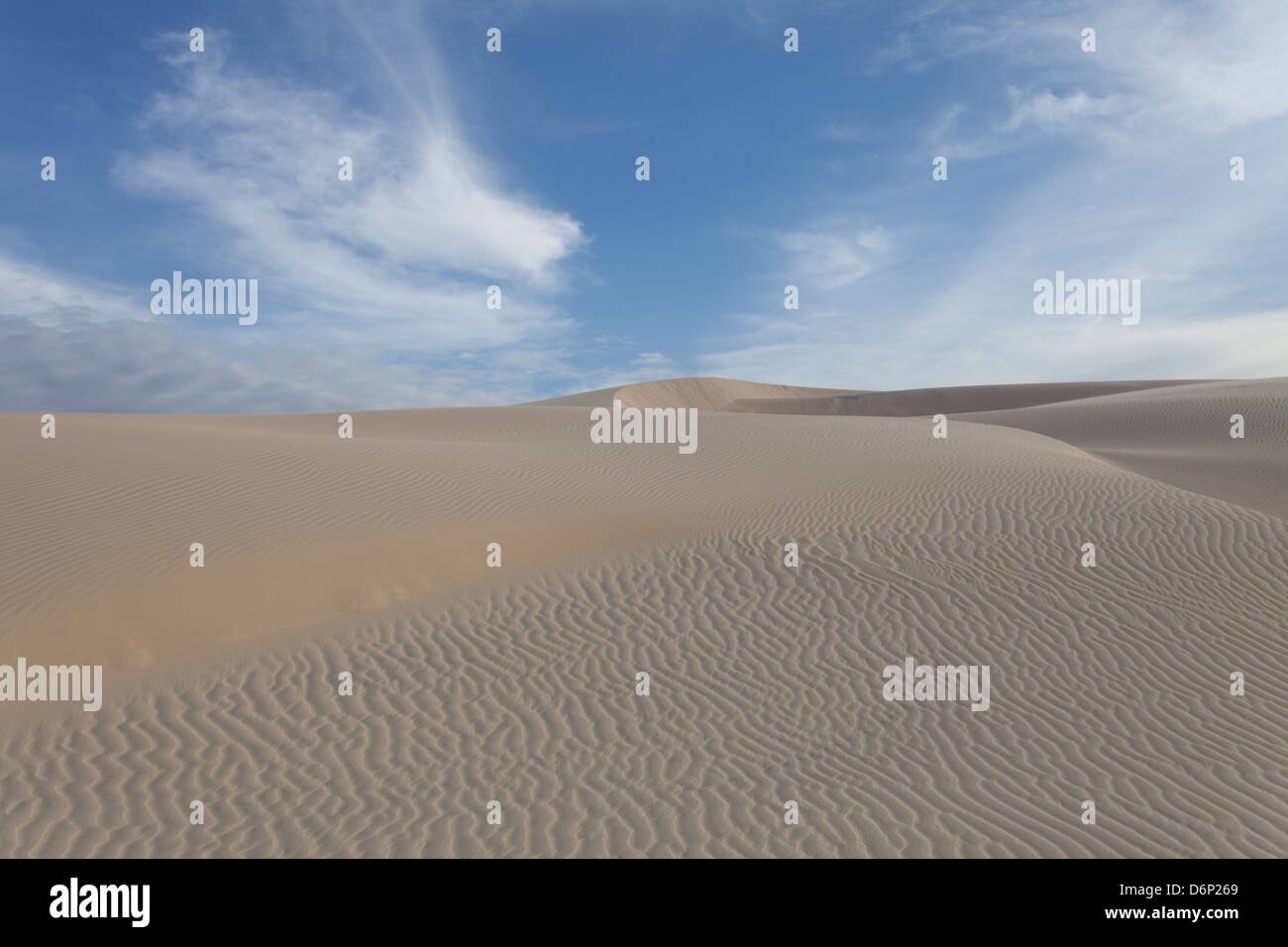 A sea of sand leading to the sky Stock Photo - Alamy