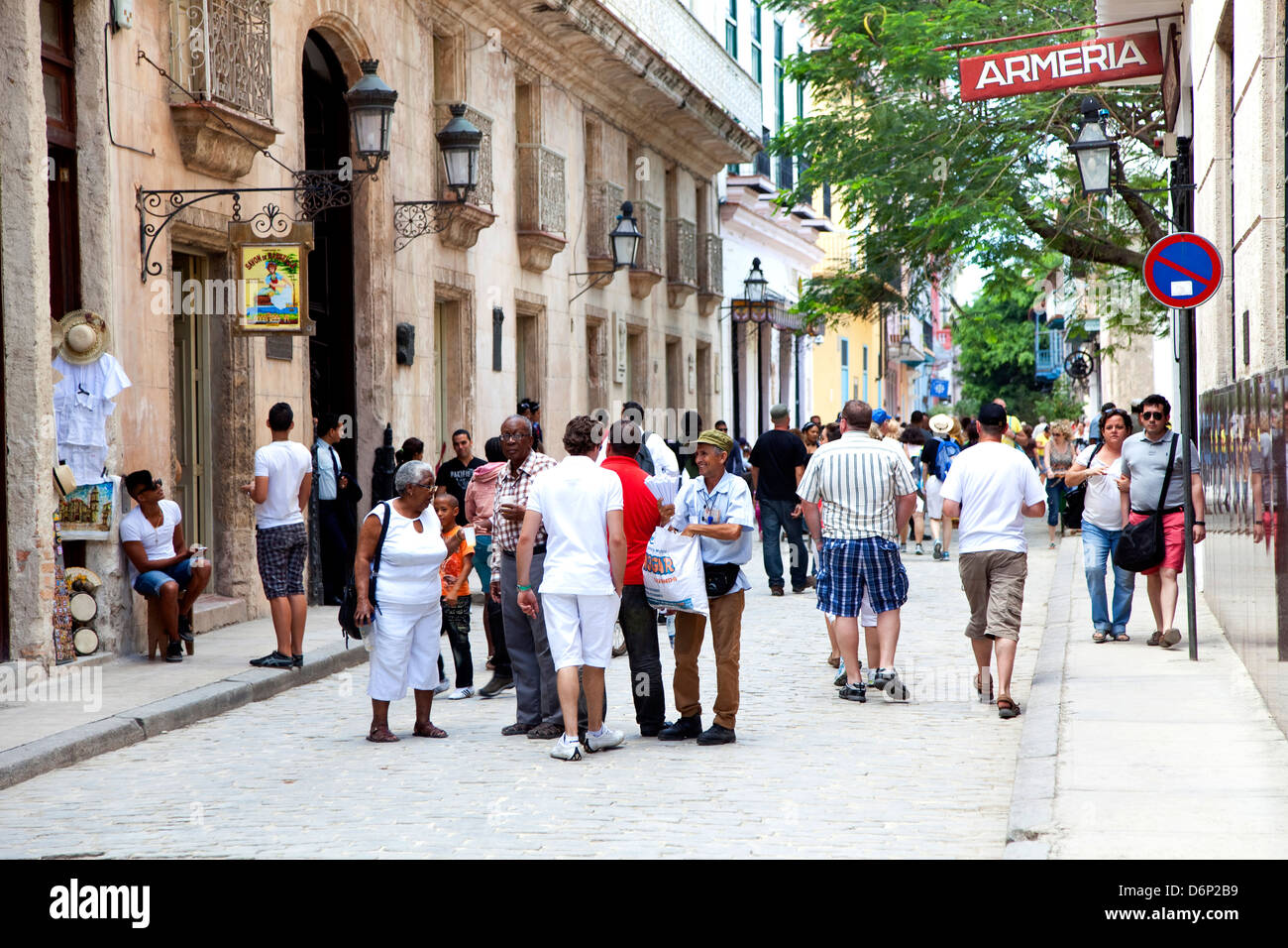 People and tourists walking in the streets of Habana Vieja. Cuban city of Havana, La Habana ...