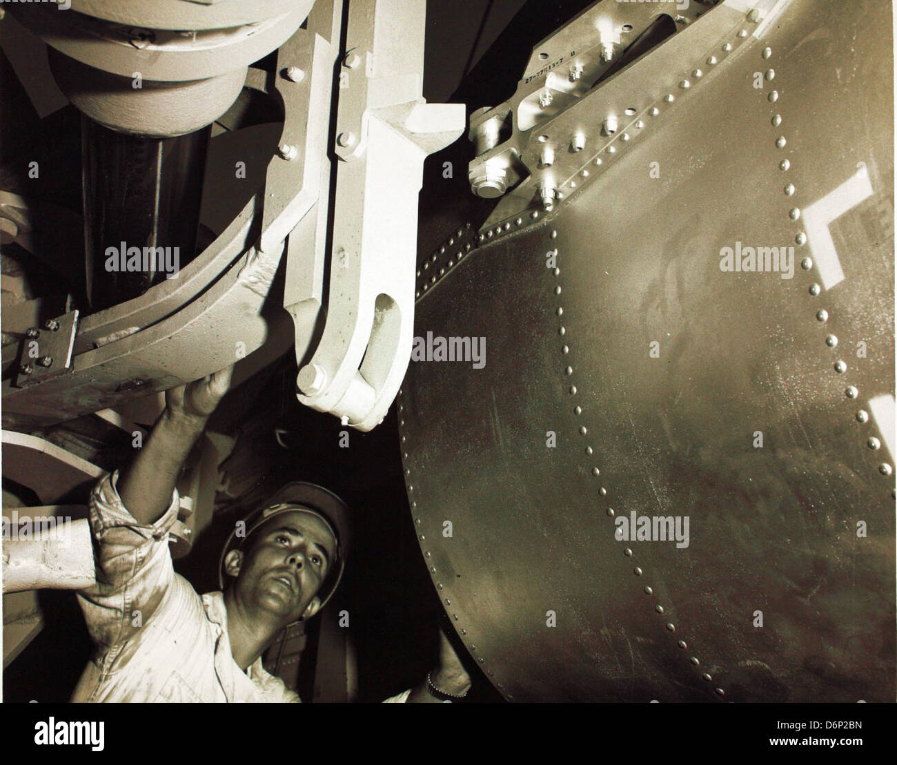 The Convair/General Dynamics Atlas 80D rocket is shown being erected at ...