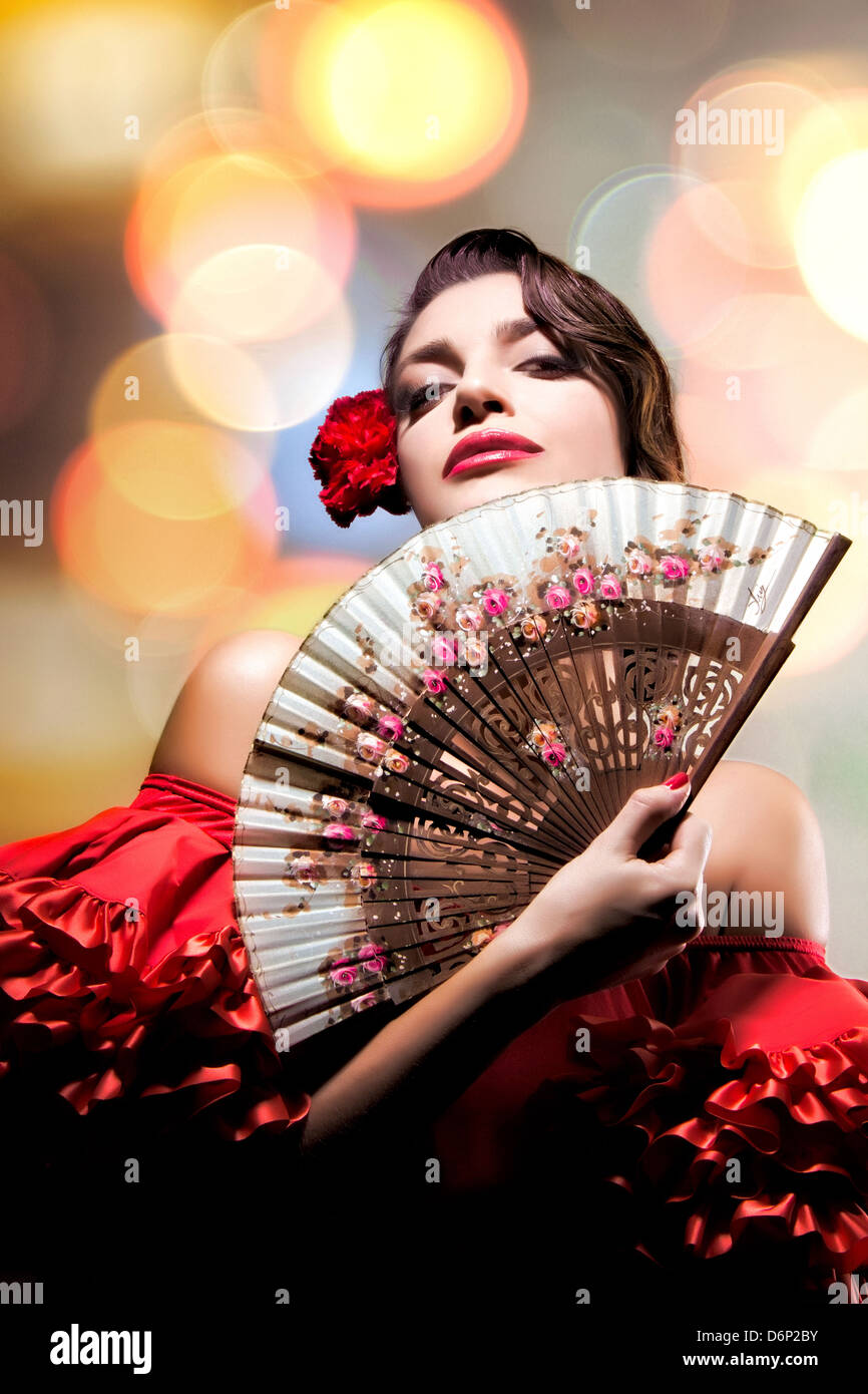 Portrait of Andalusian woman with fan looking at camera Stock Photo - Alamy