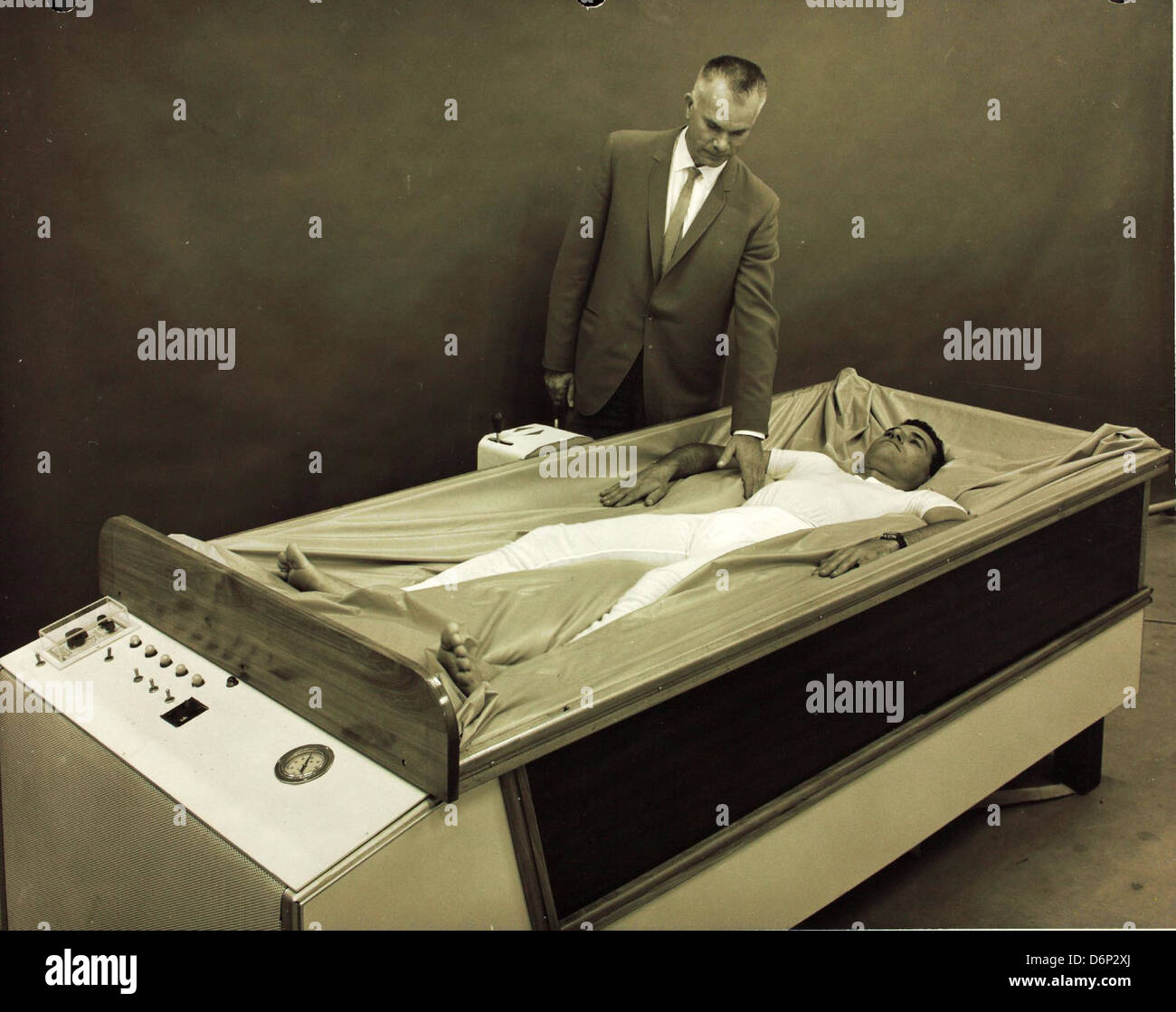 A photograph of a dry immersion bed being used in the Convair/General ...