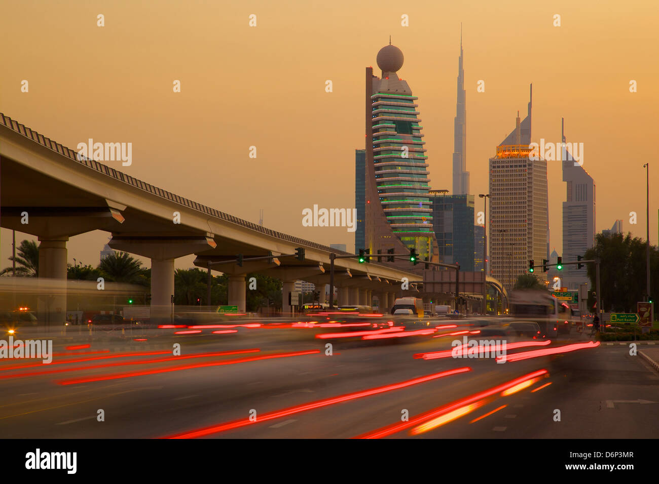 City skyline and car trail lights at sunset, Dubai, United Arab ...