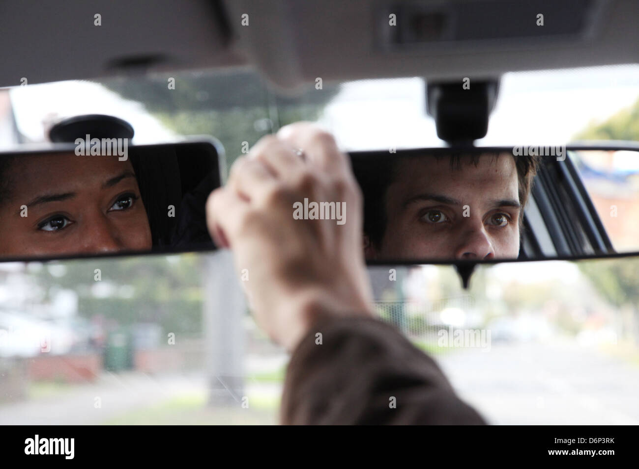 Mirrors showing a new driver and instructor in the mirrors Stock Photo ...