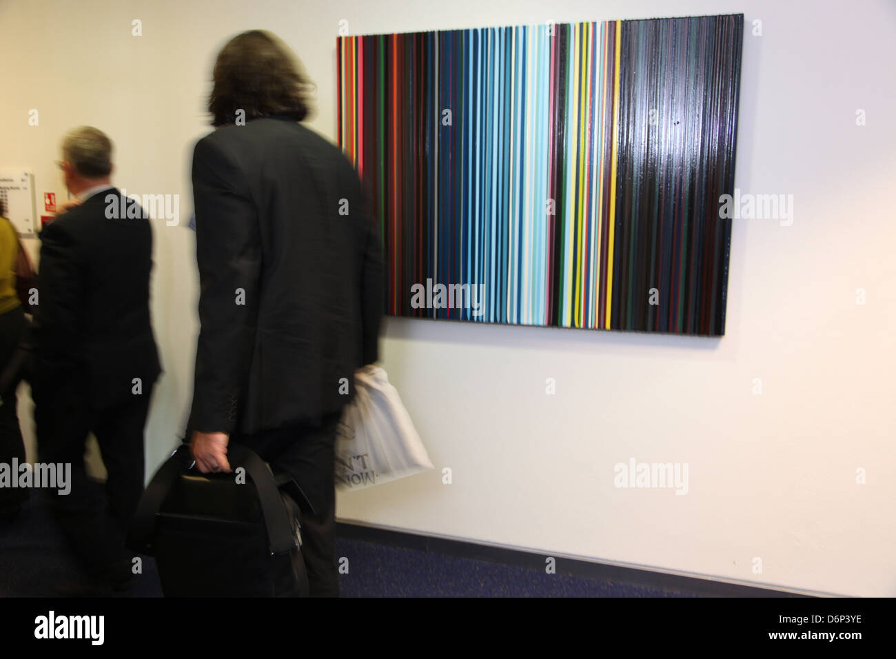 A painting hanging in an office used to add colour to a dull ...