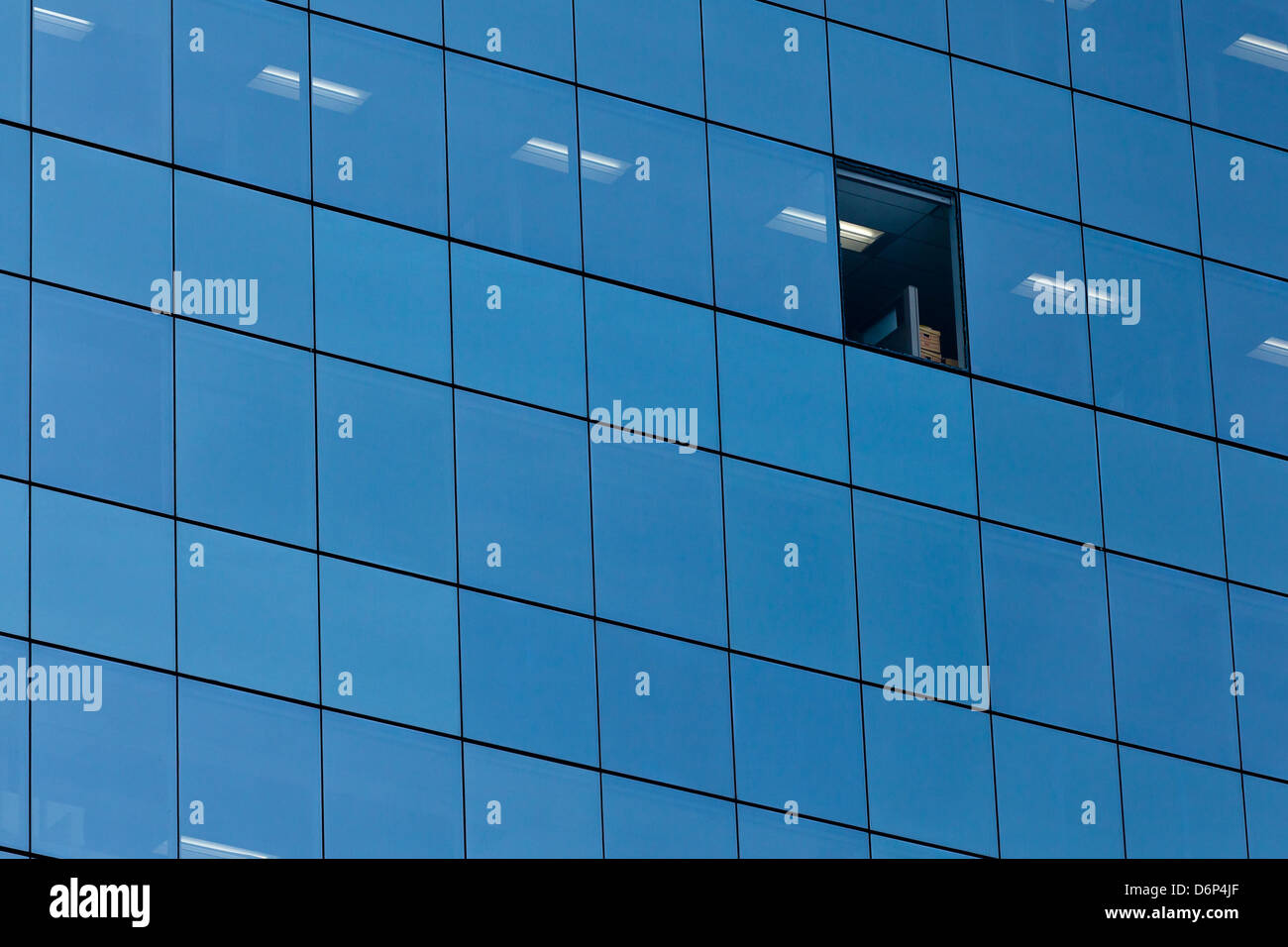 A missing glass pane in a 'glass box' building can serve as a symbol or ...