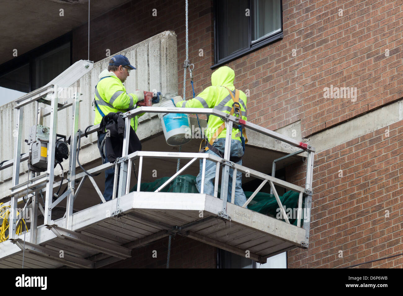 Construction workers on building exterior Stock Photo - Alamy