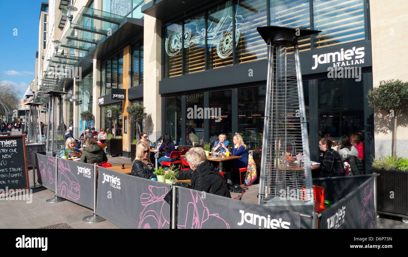 People sitting at tables dining outside Jamie's Italian Restaurant ...