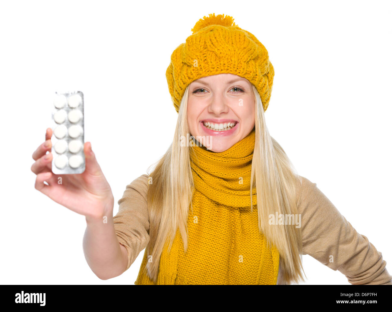 Happy girl in autumn clothes showing pills pack Stock Photo - Alamy