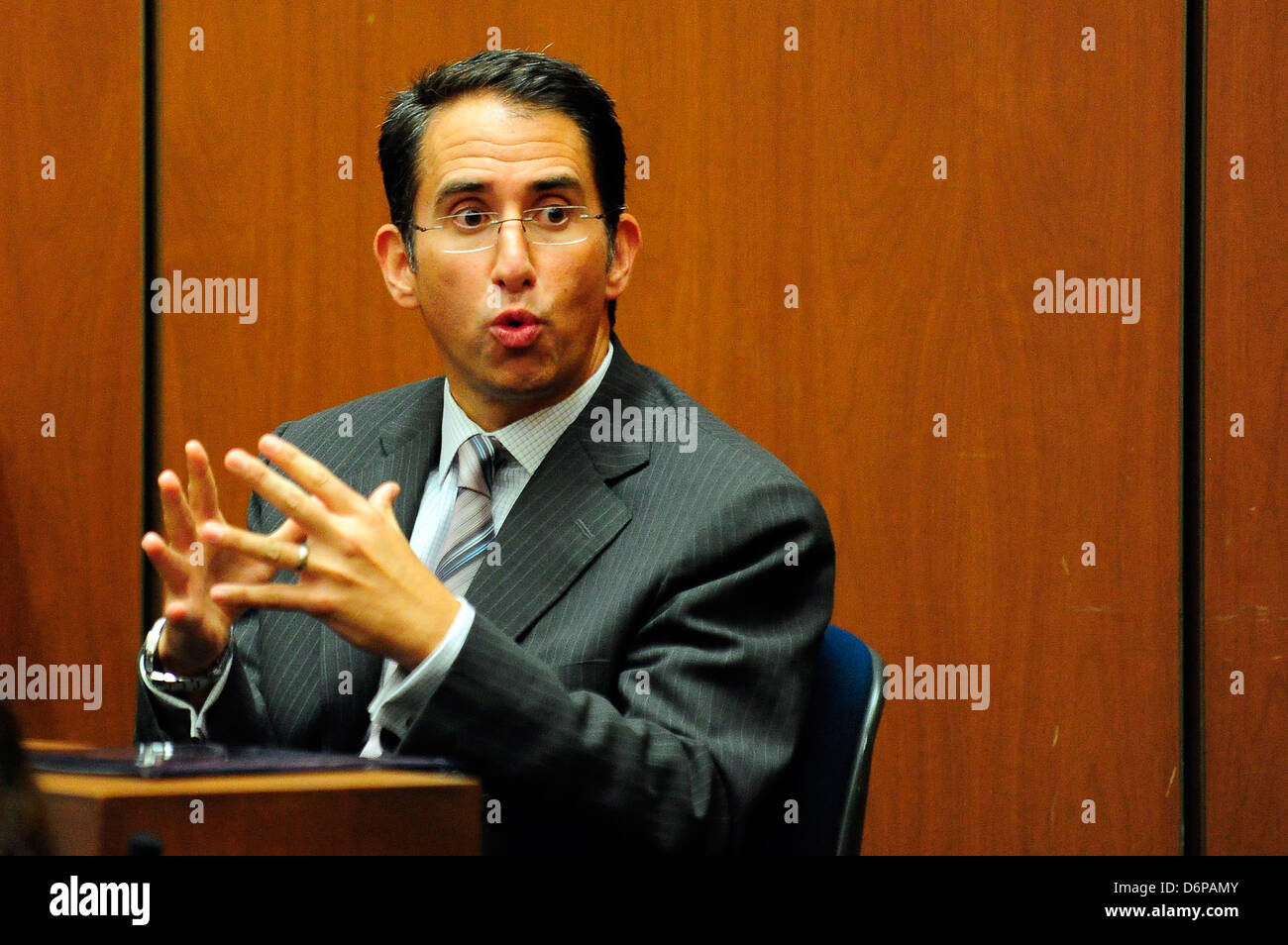 Dr. Nader Kamangar gestures while speaking from the witness stand ...