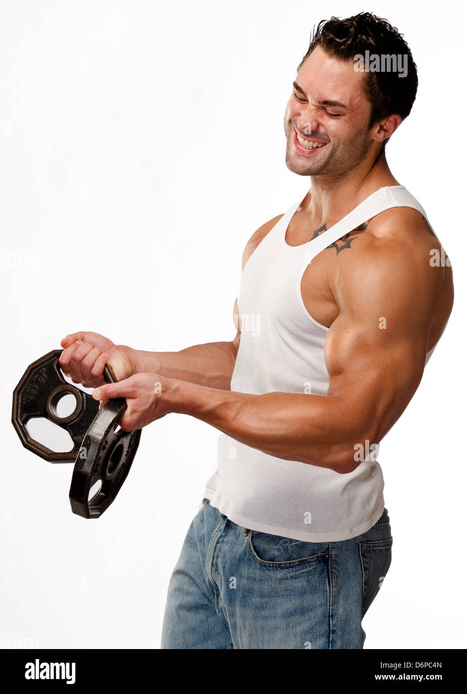 Man holding weights Stock Photo - Alamy