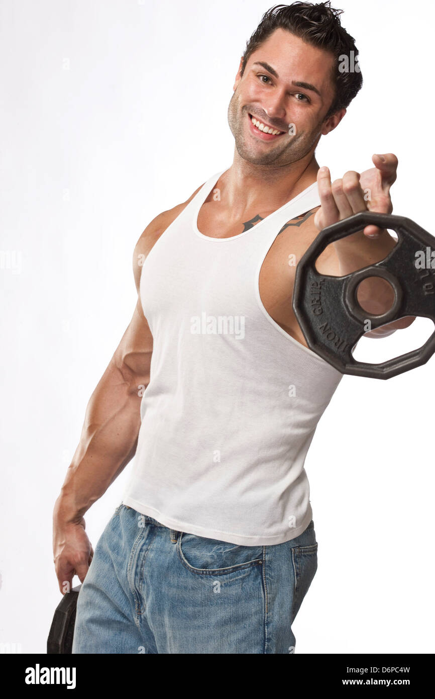 Man holding weights Stock Photo - Alamy