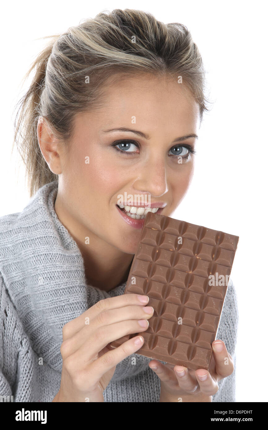 Woman Eating Chocolate Bar Stock Photo - Alamy