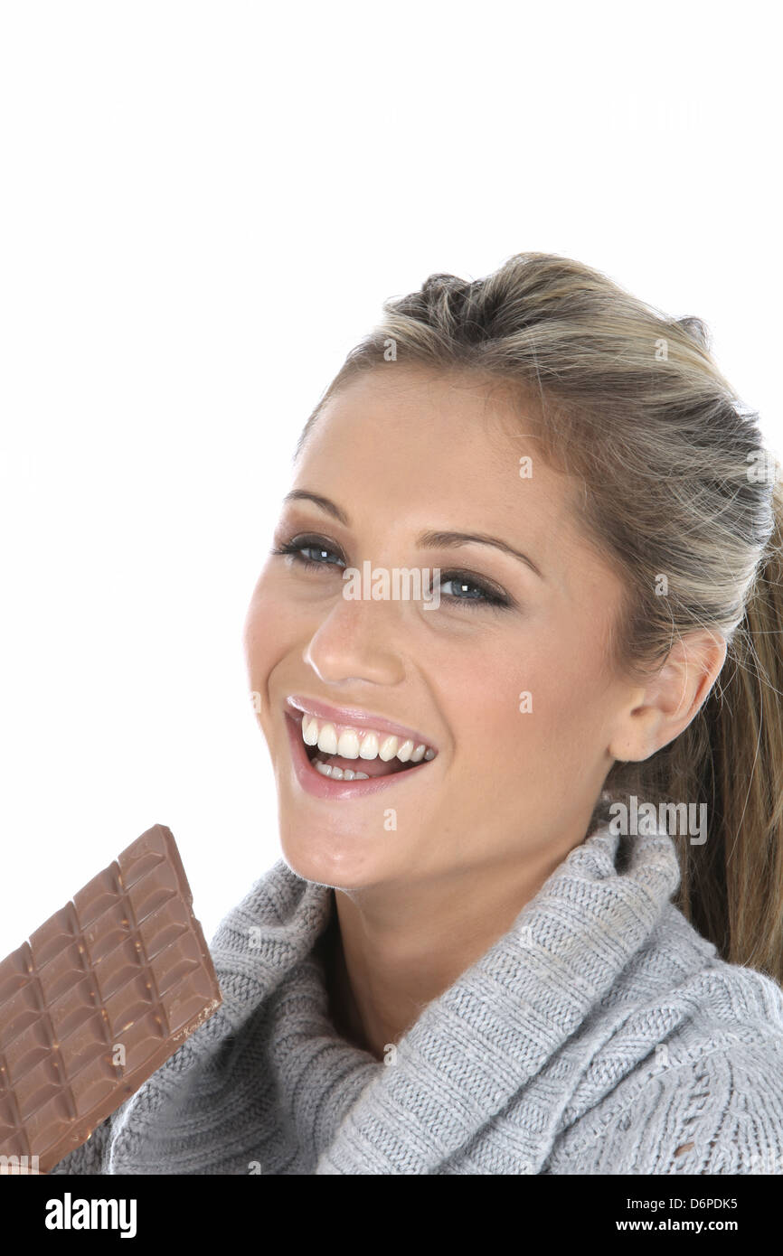 Woman eating chocolate bar hi-res stock photography and images - Alamy