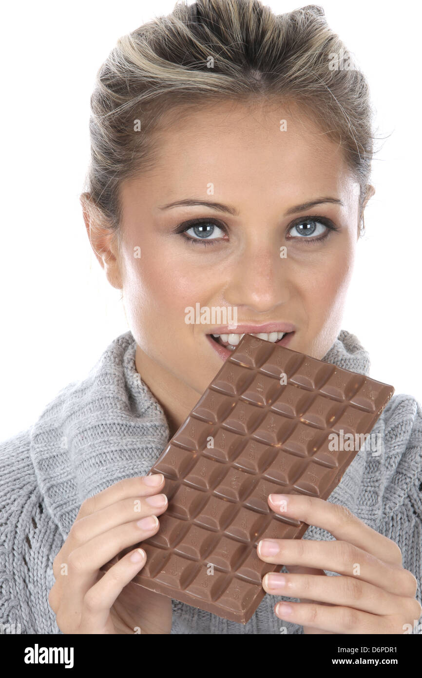 Woman Eating Chocolate Bar Stock Photo - Alamy