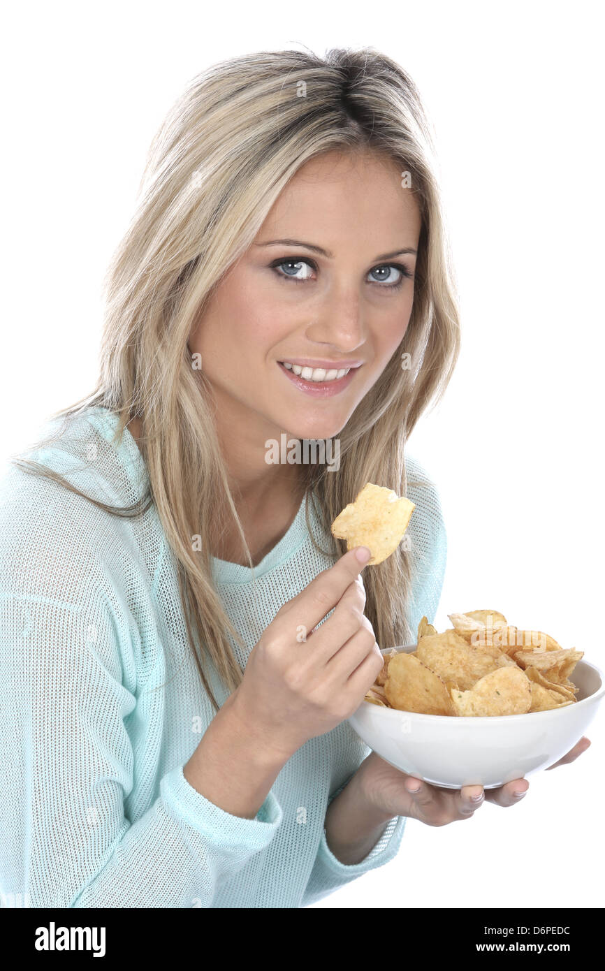 Young Relaxing Woman Eating Crispy Flavoured Potato Crisps From A Bowl ...