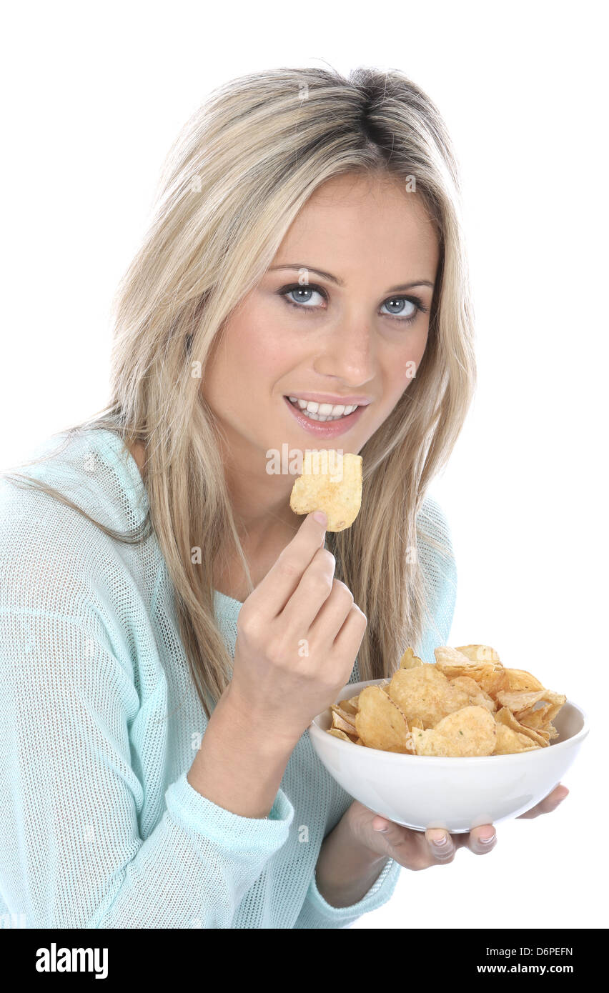 Young Relaxing Woman Eating Crispy Flavoured Potato Crisps From A Bowl ...