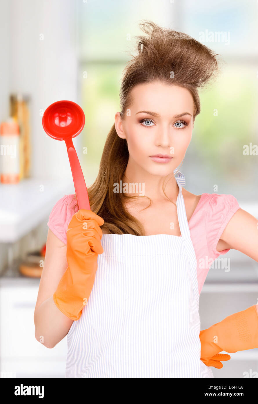 housewife with red ladle Stock Photo - Alamy