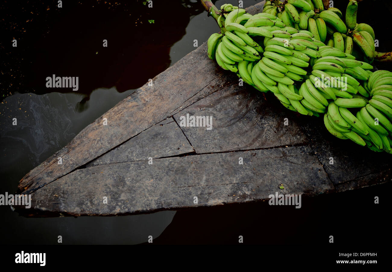 Bunch of bananas on a canoe on the Amazon river Stock Photo - Alamy