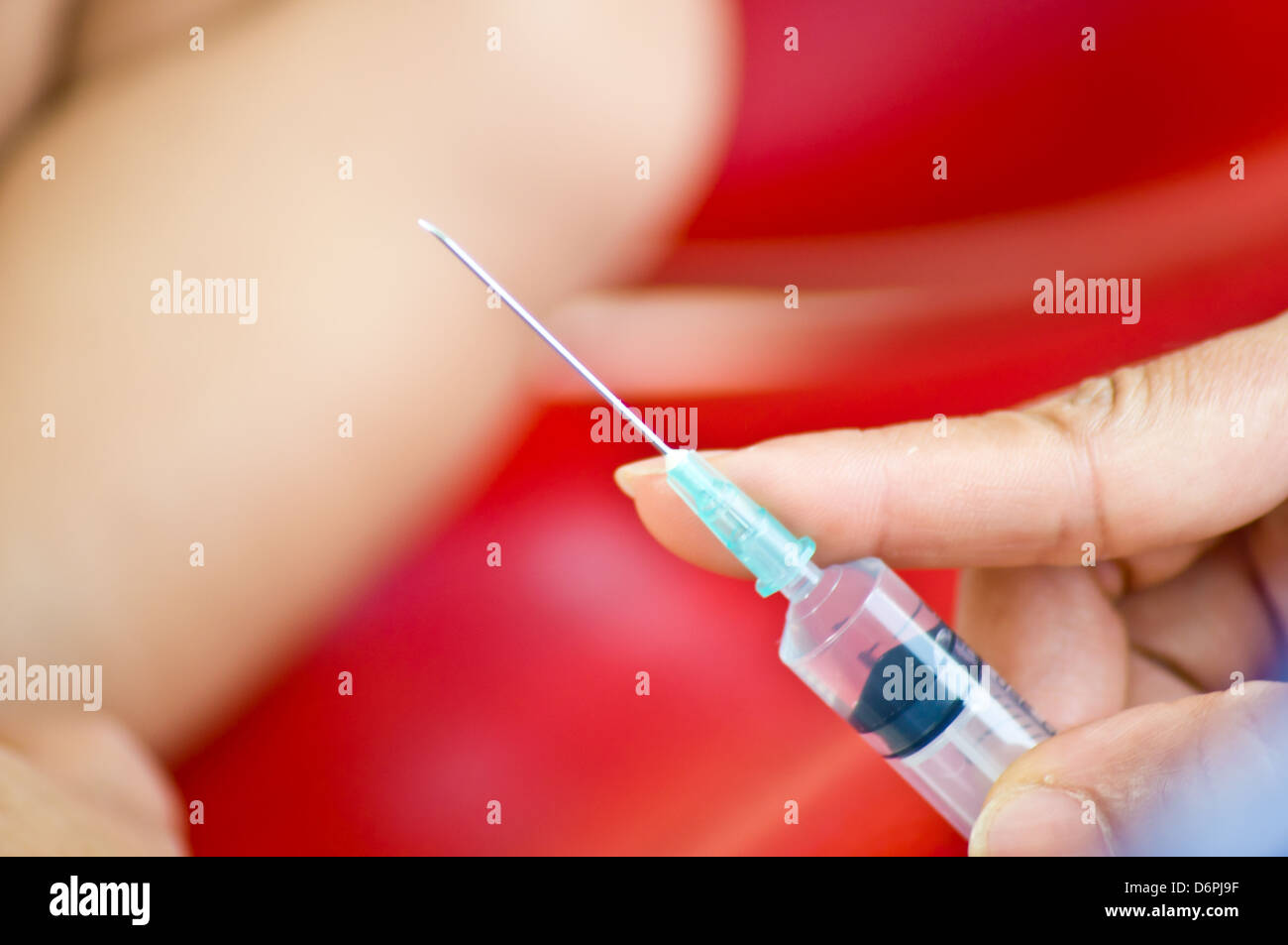 Baby and injection hi-res stock photography and images - Alamy
