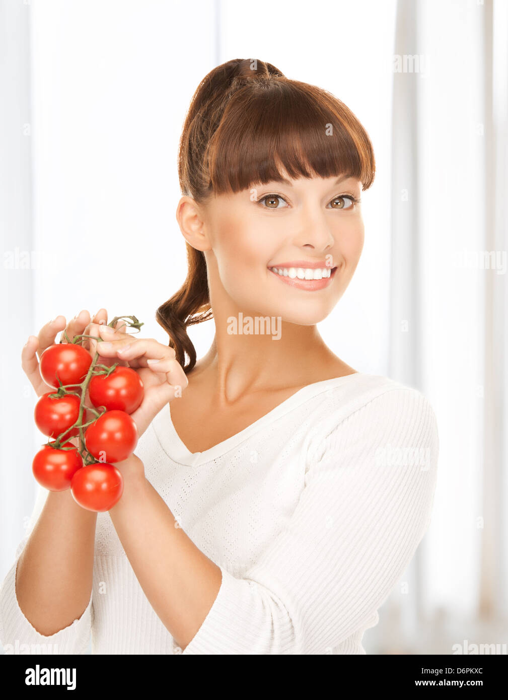 beautiful woman with shiny tomatoes Stock Photo - Alamy