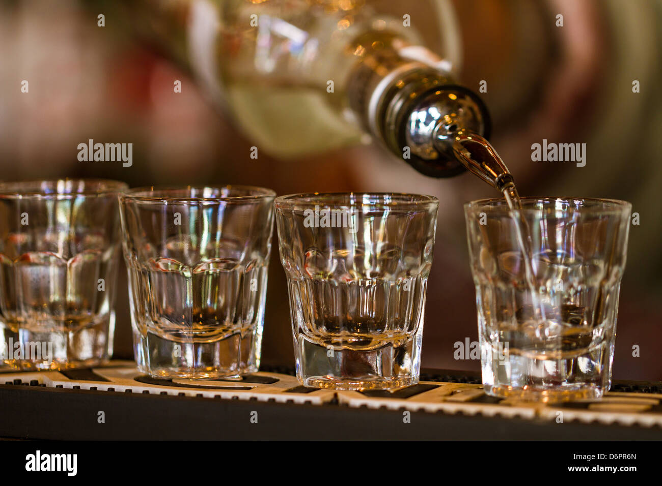 Barman make alcoholic shots in nightclub Stock Photo - Alamy