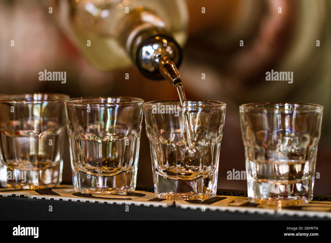 Barman make alcoholic shots in nightclub Stock Photo - Alamy
