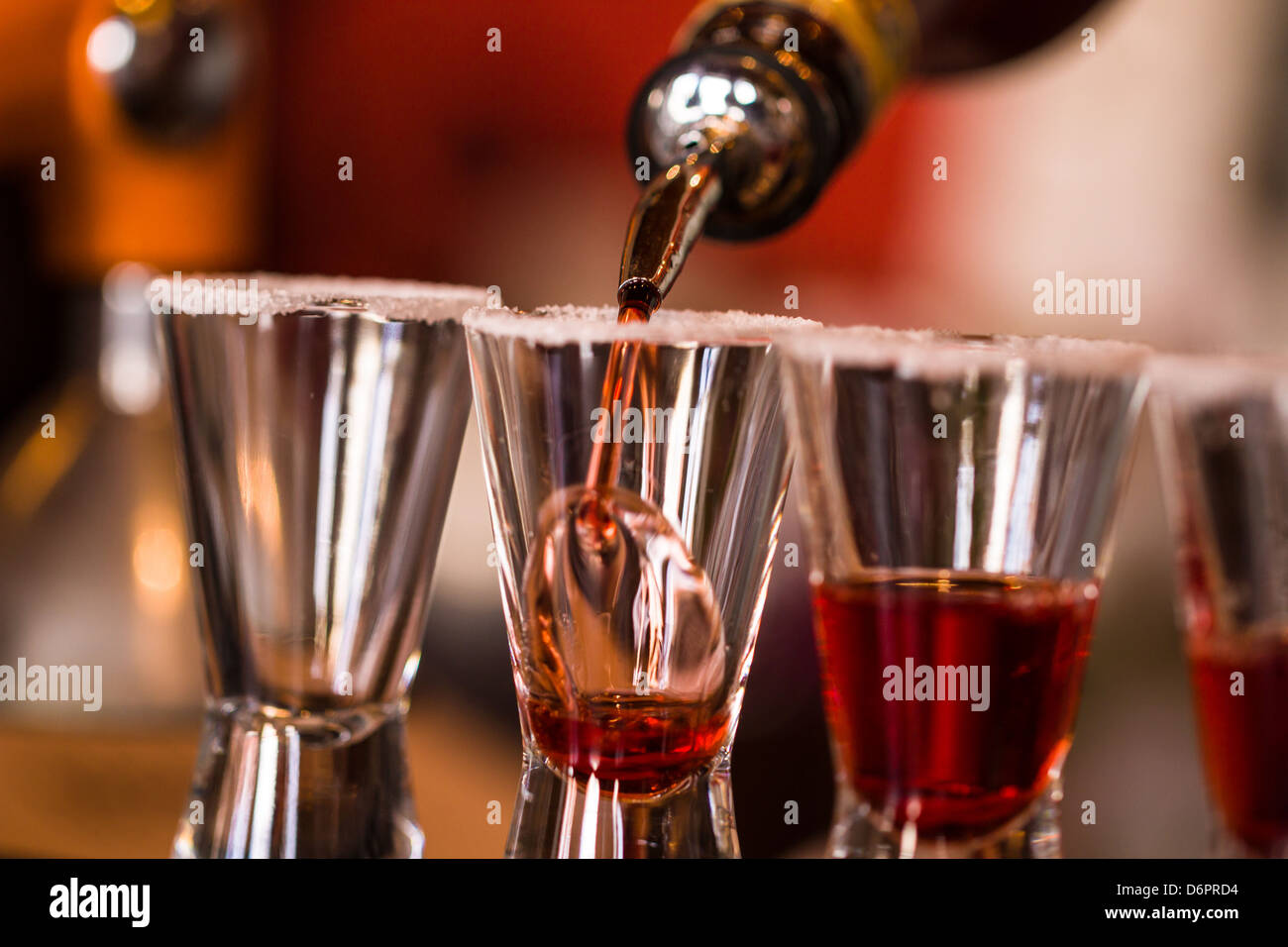 Barman make alcoholic shots in nightclub Stock Photo - Alamy