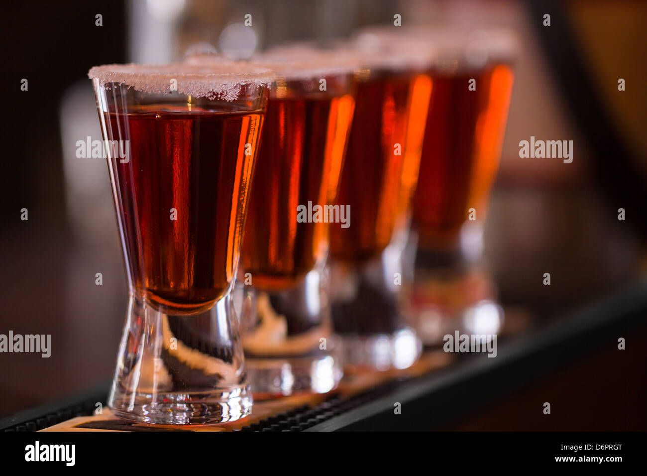 Barman make alcoholic shots in nightclub Stock Photo - Alamy