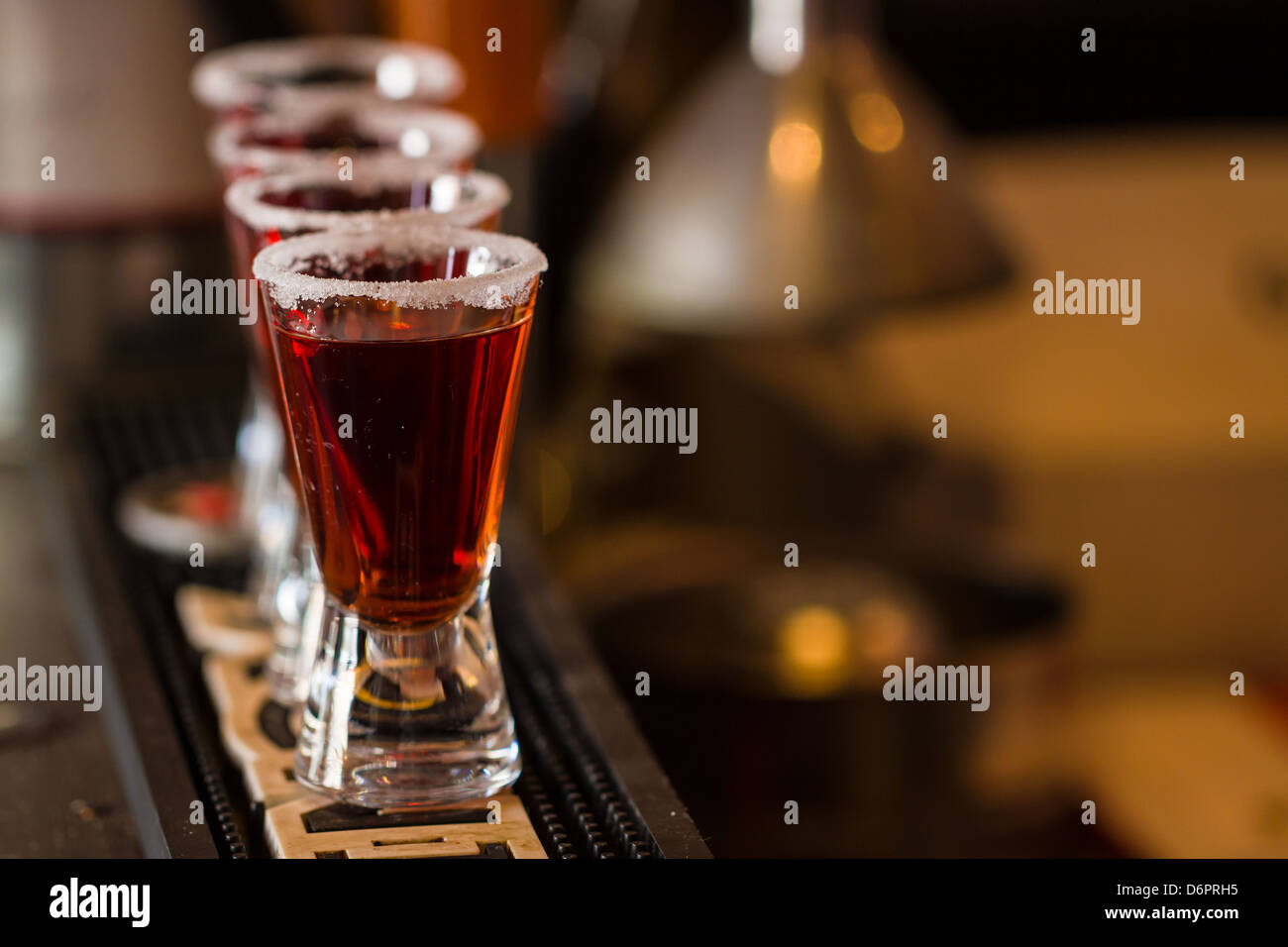 Barman make alcoholic shots in nightclub Stock Photo - Alamy