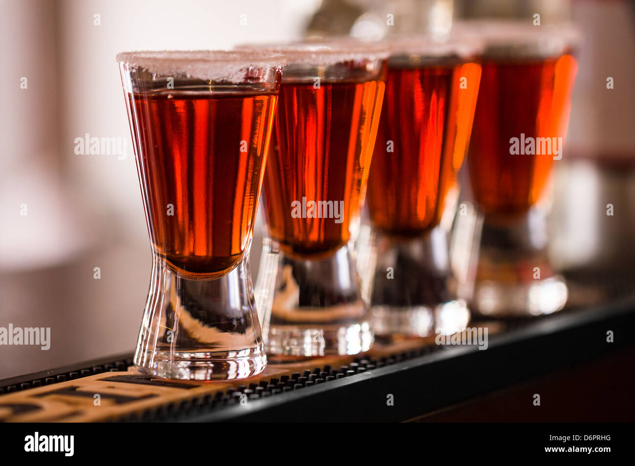 Barman make alcoholic shots in nightclub Stock Photo - Alamy