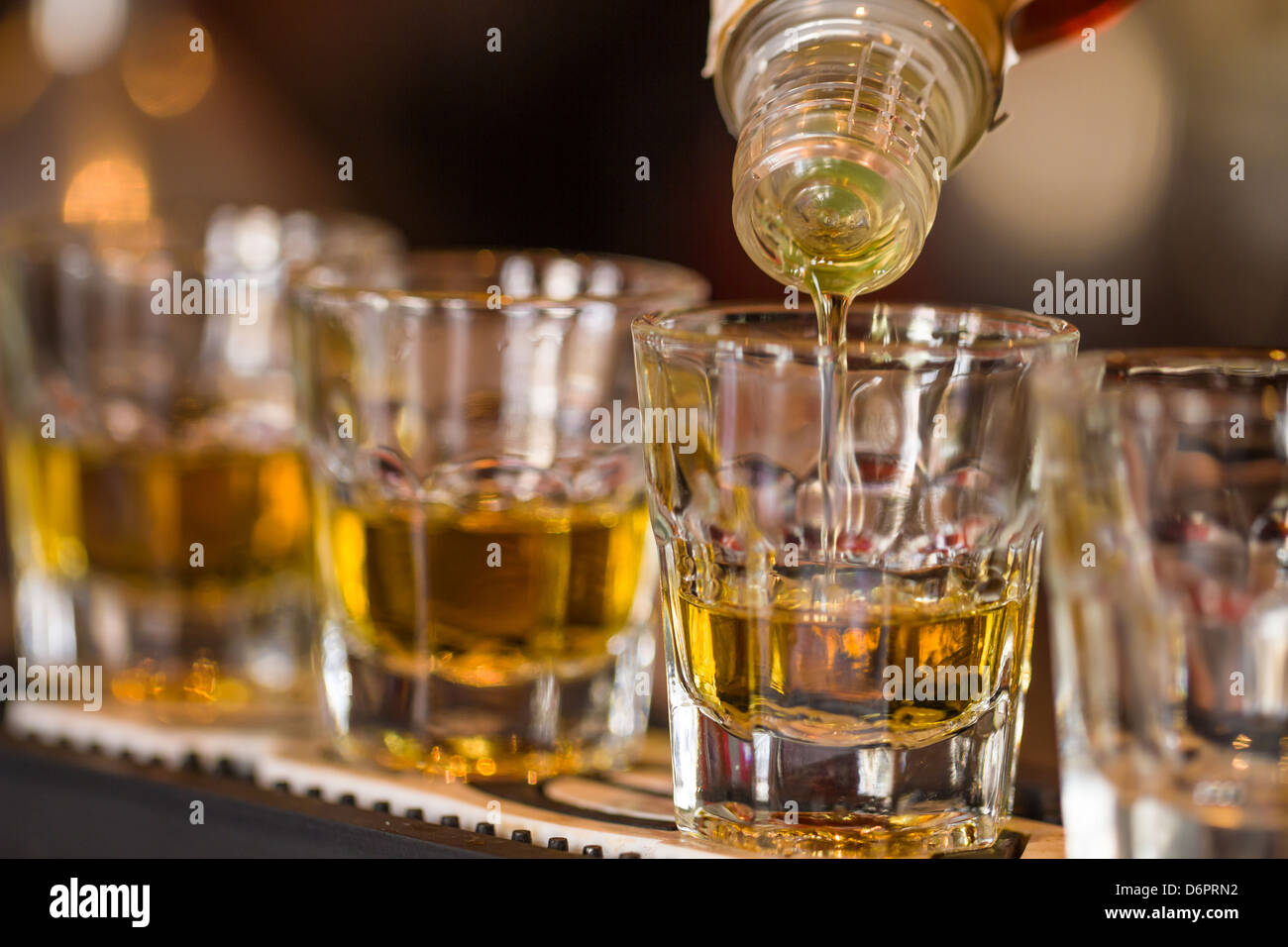 Barman make alcoholic shots in nightclub. Cocktail bar and cocktail ...