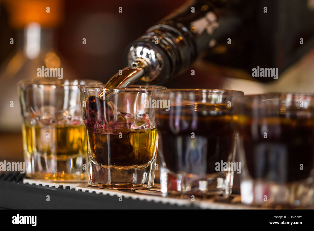 Barman make alcoholic shots in nightclub. Cocktail bar and cocktail ...