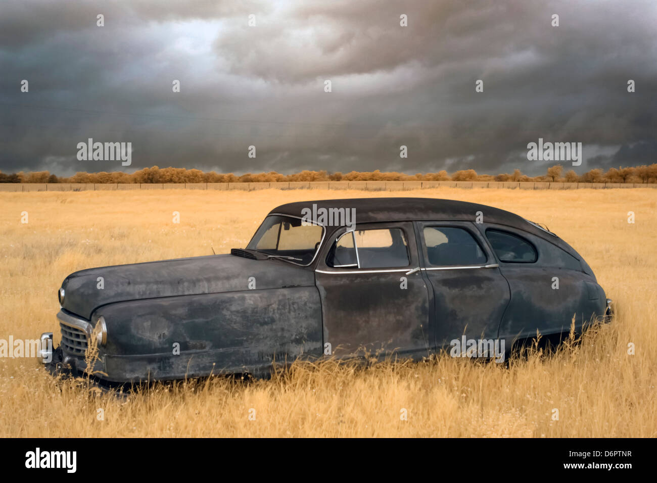 Old car rusting away in a field Stock Photo - Alamy