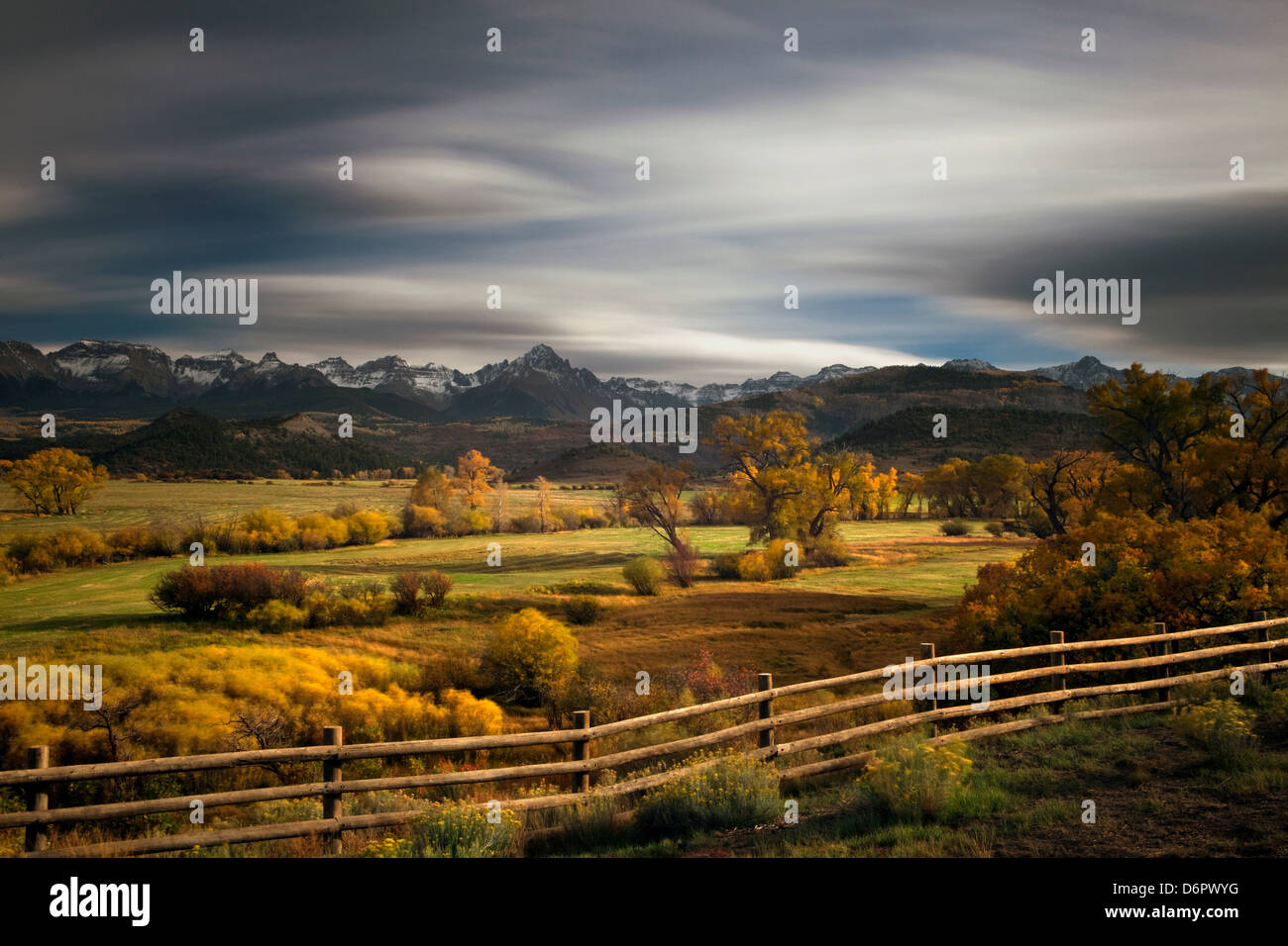 Field with mountain range in the background, Dallas Divide, Colorado ...