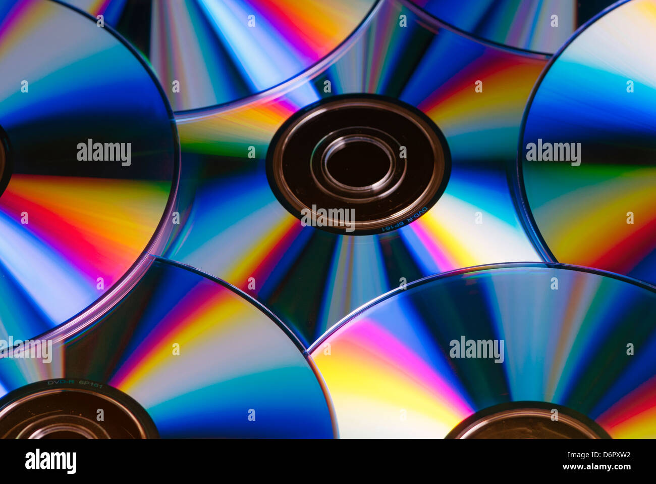 a collection of cd, dvd disks with rainbow colour reflections Stock ...