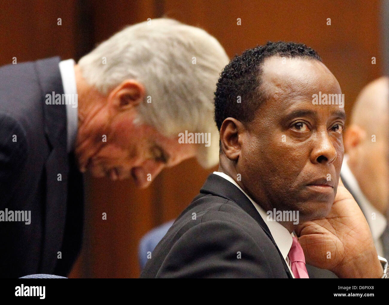 Dr.Conrad Murray sits at the defense table with his attorney J. Michael ...