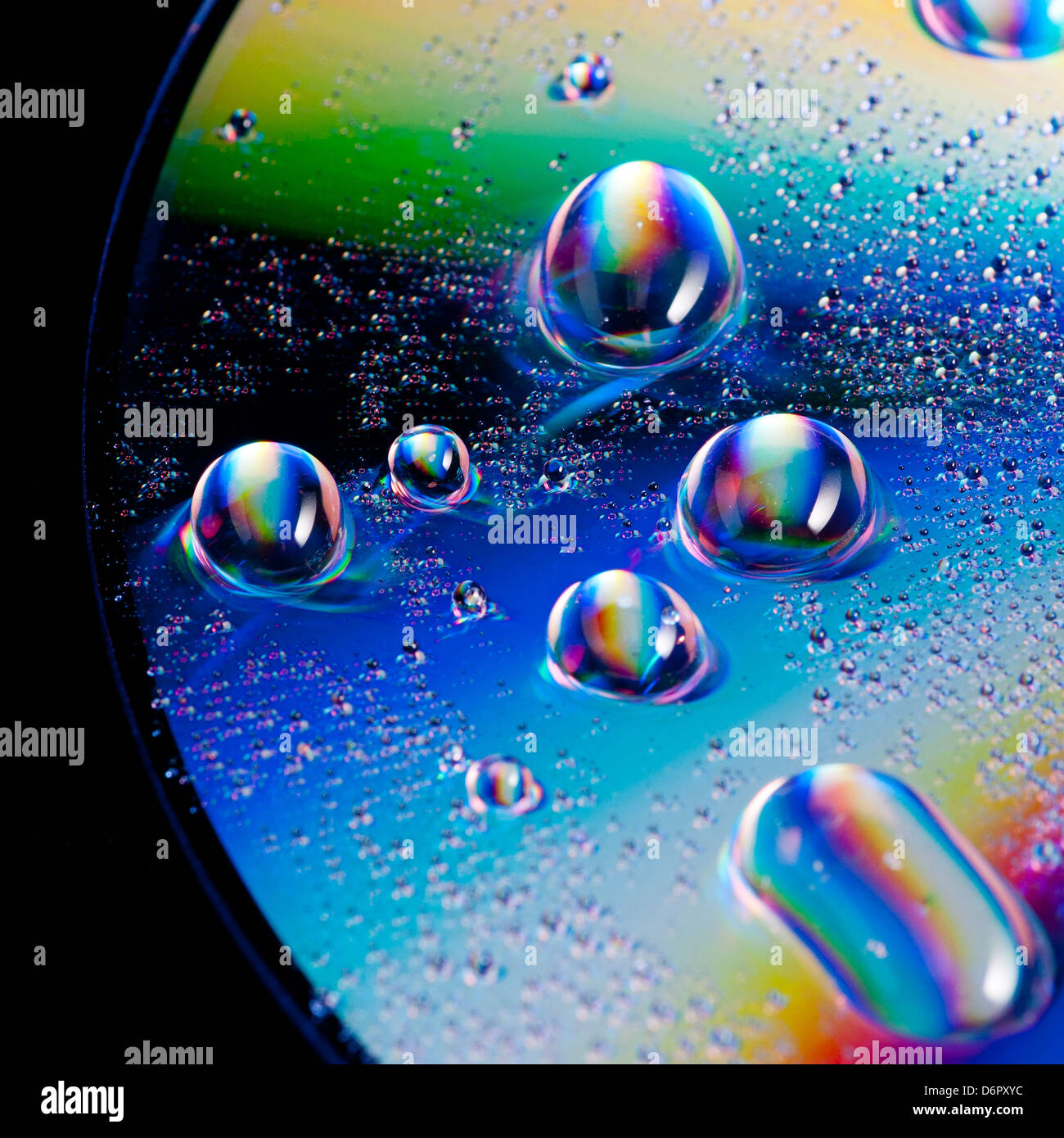 water drops on shiny surface, rainbow colours, close up Stock Photo - Alamy