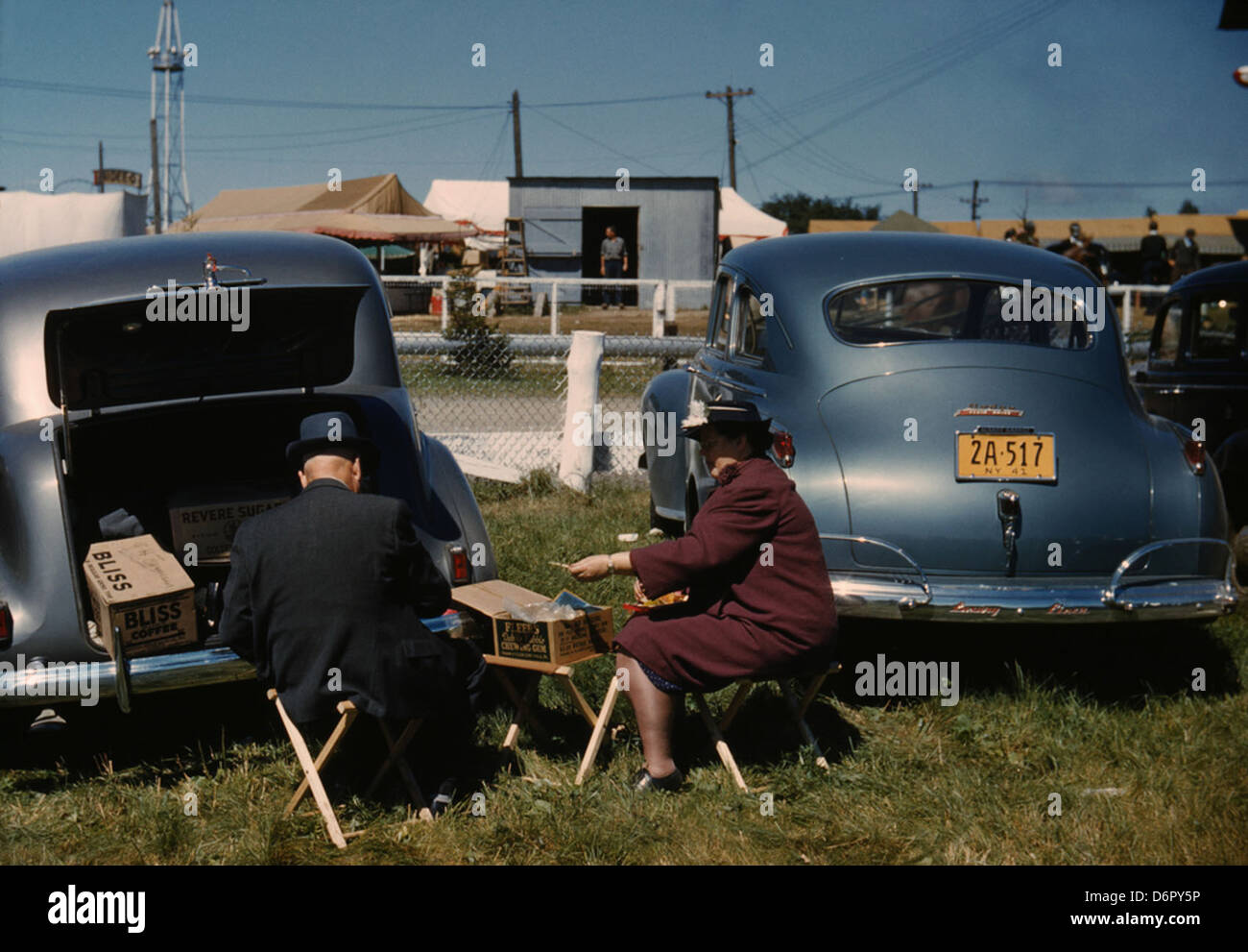 A photograph by Jack Delano capturing picnickers at the state fair in Rutland, Vermont, in 1941 ...