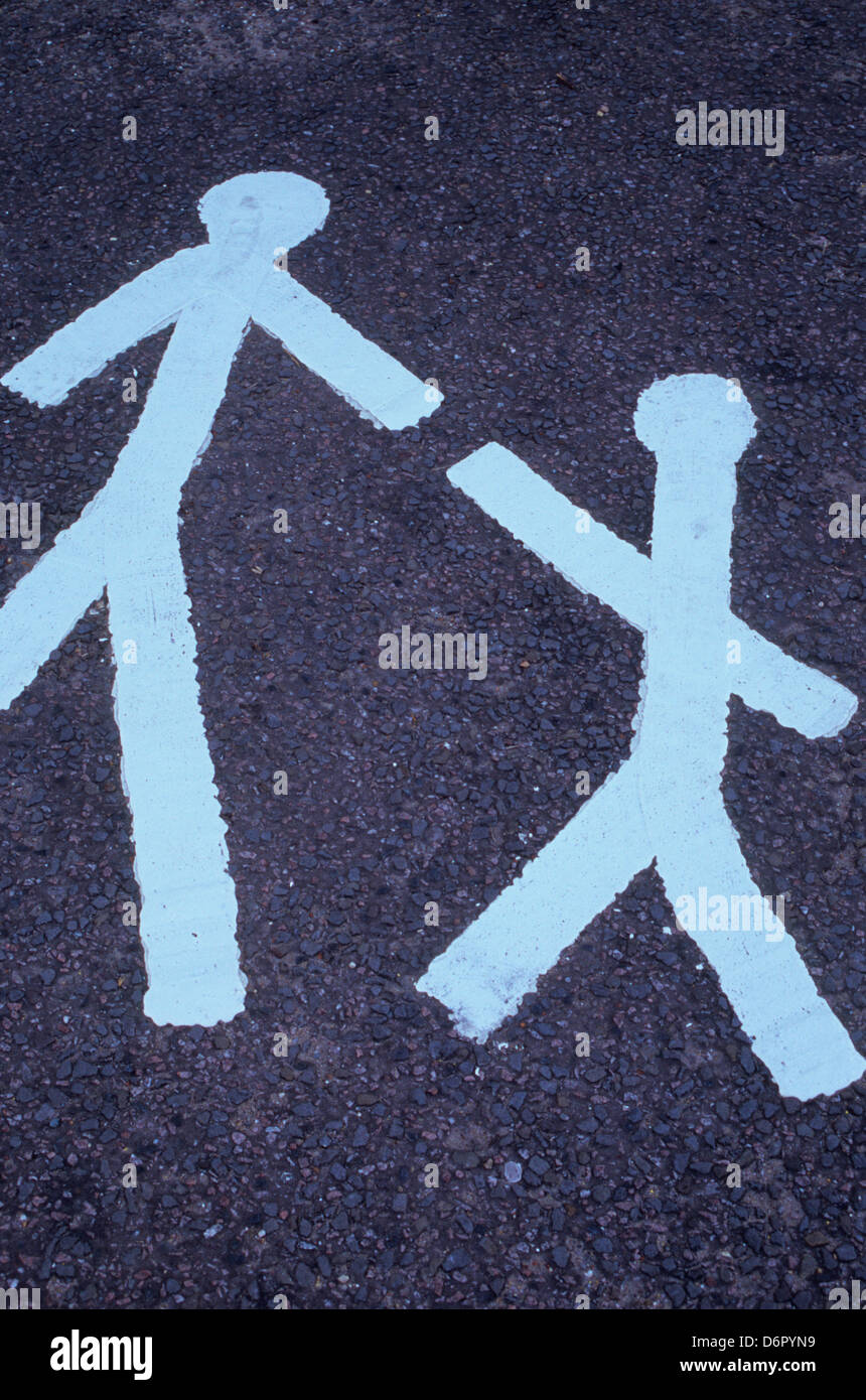 UK, England, Suffolk, Stick figure adult and child painted on road to ...