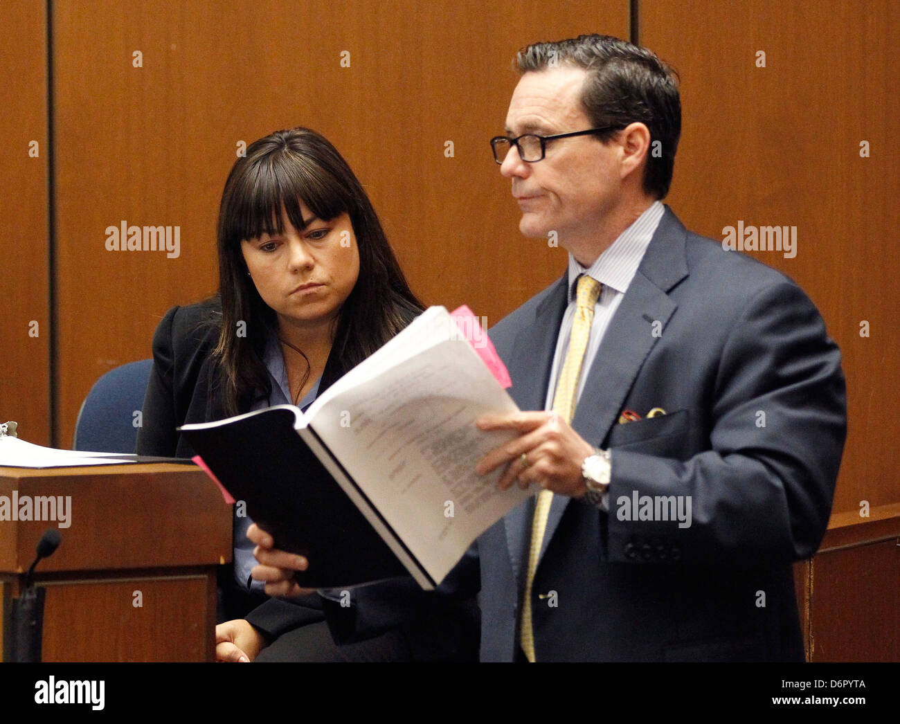 Los Angeles County coroner investigator Elissa Fleak is shown documents ...