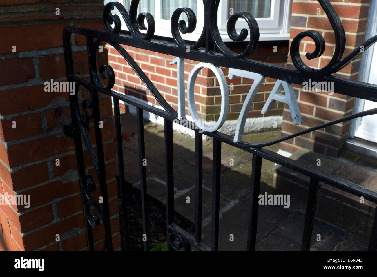 Wrought iron gate and house number, Brighton and Hove Stock Photo - Alamy