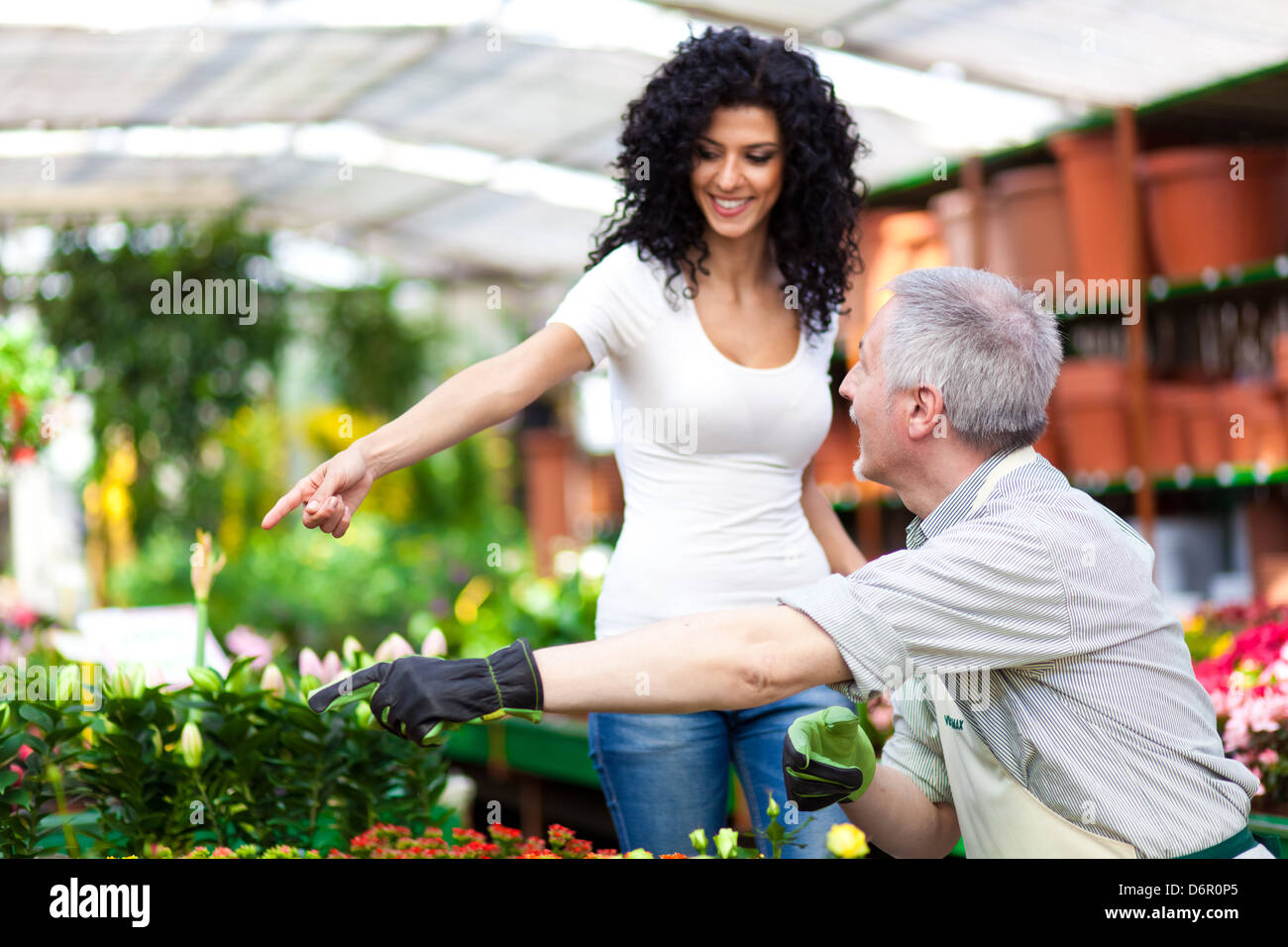 Woman customer talking shop assistant hi-res stock photography and ...