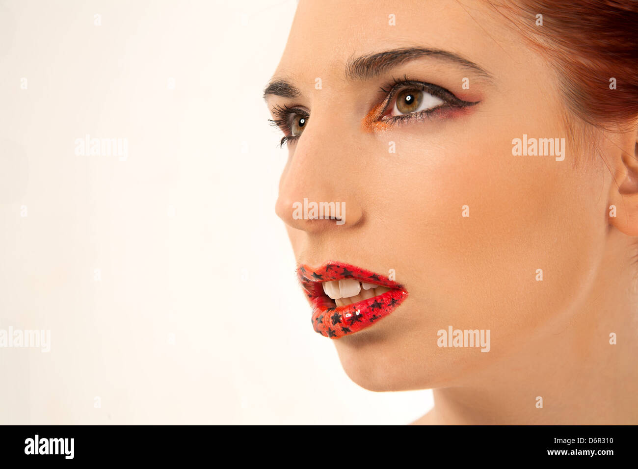 Female portrait with colourful lip makeup with stars Stock Photo - Alamy