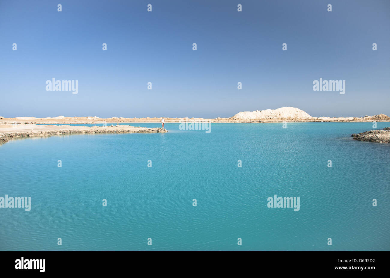Amazing Blue lake among the sand and rocks Stock Photo - Alamy