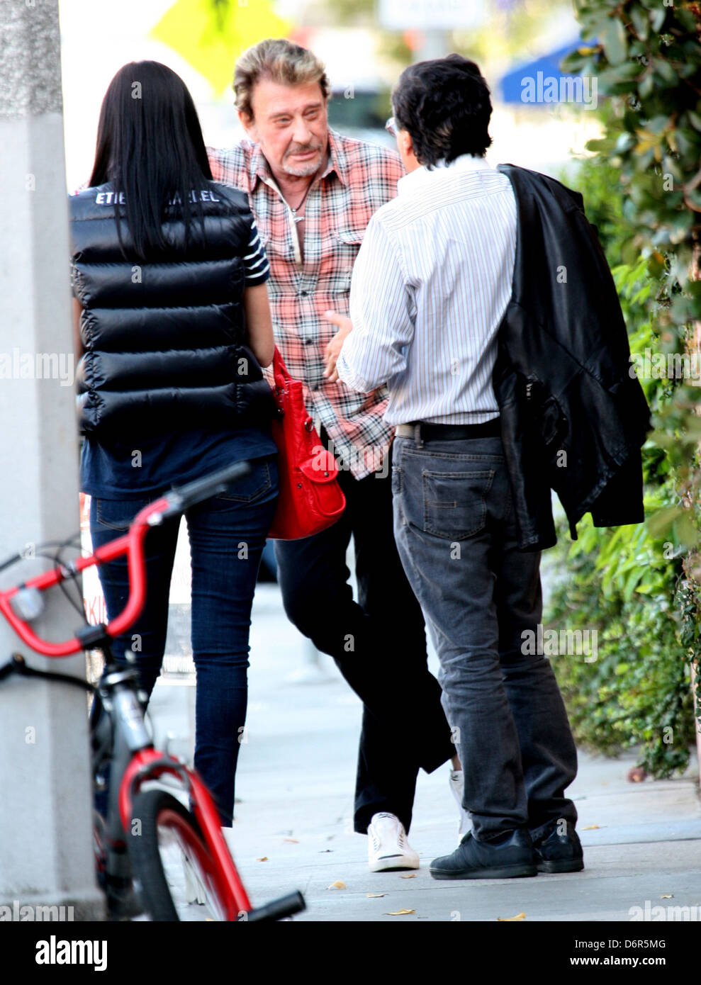 Marc Krief and Johnny Hallyday leave Villetta restaurant after a ...
