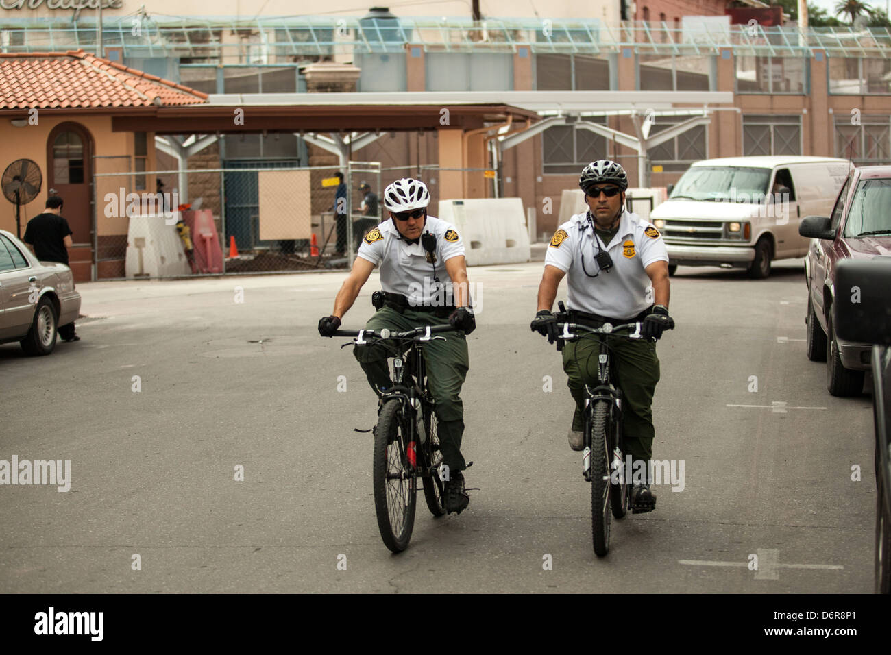 US Customs and Border officers patrol on bicycle the border from ...