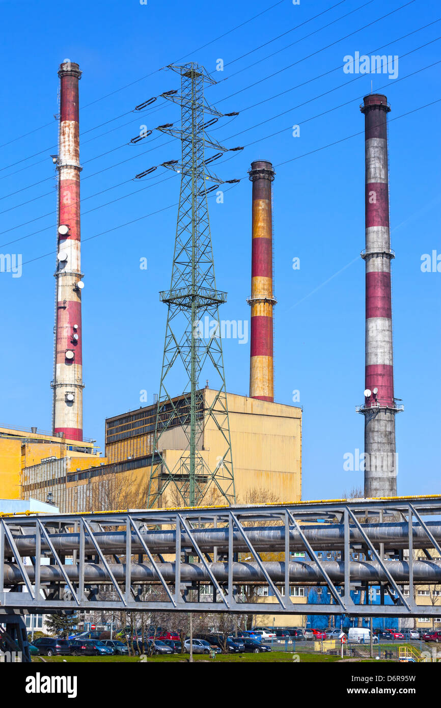 Power station with chimneys on blue sky background Stock Photo - Alamy