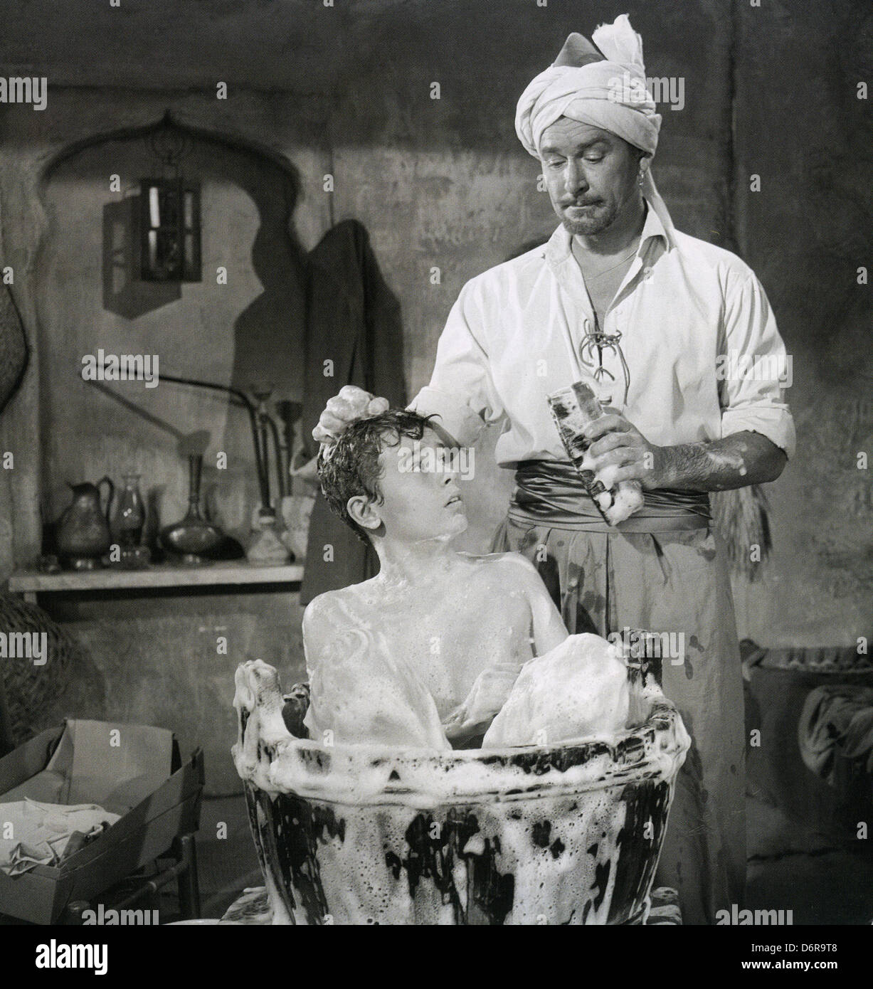 KIM 1950 MGM film with Errol Flynn as Mahbub Ali and Dean Stockwell as the boy Kim Stock Photo ...